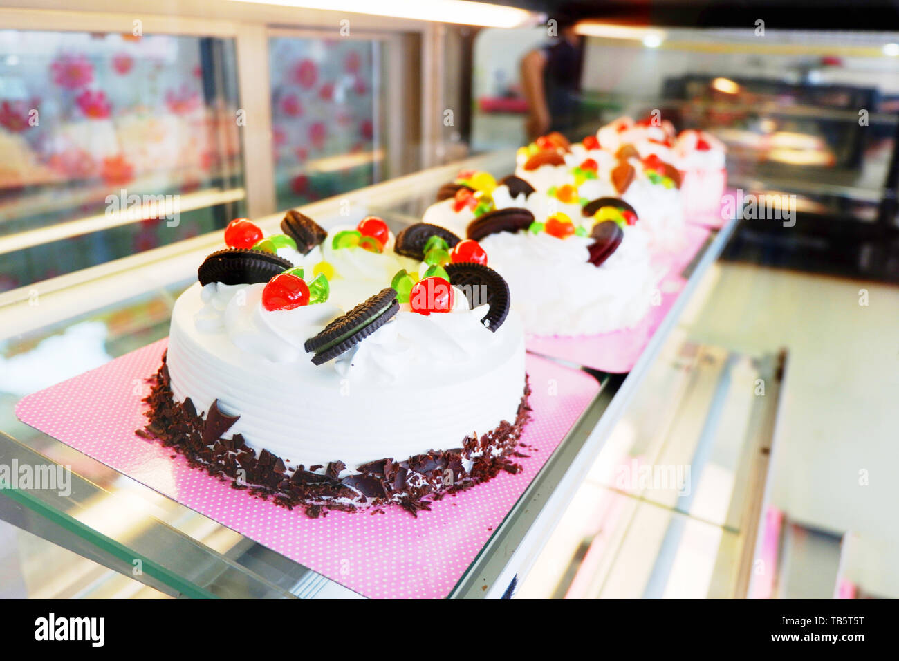 Cake tray colorful in showcase glass display at store bakery pastry ...