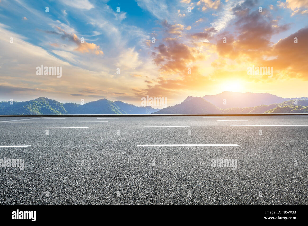 Empty highway road and beautiful mountain with clouds landscape Stock ...