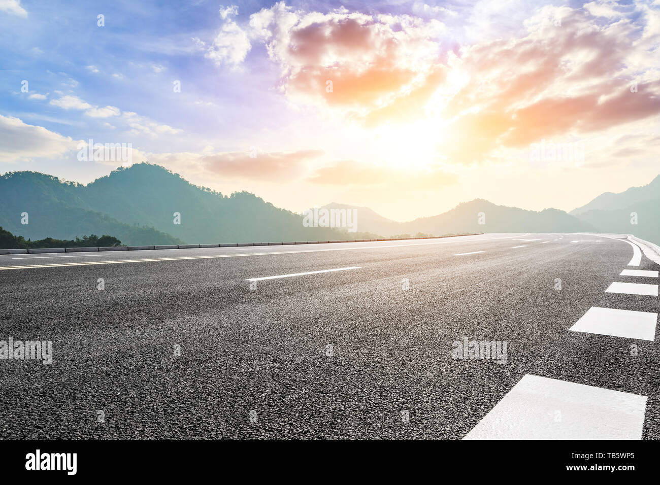 Empty highway road and beautiful mountain with clouds landscape Stock ...