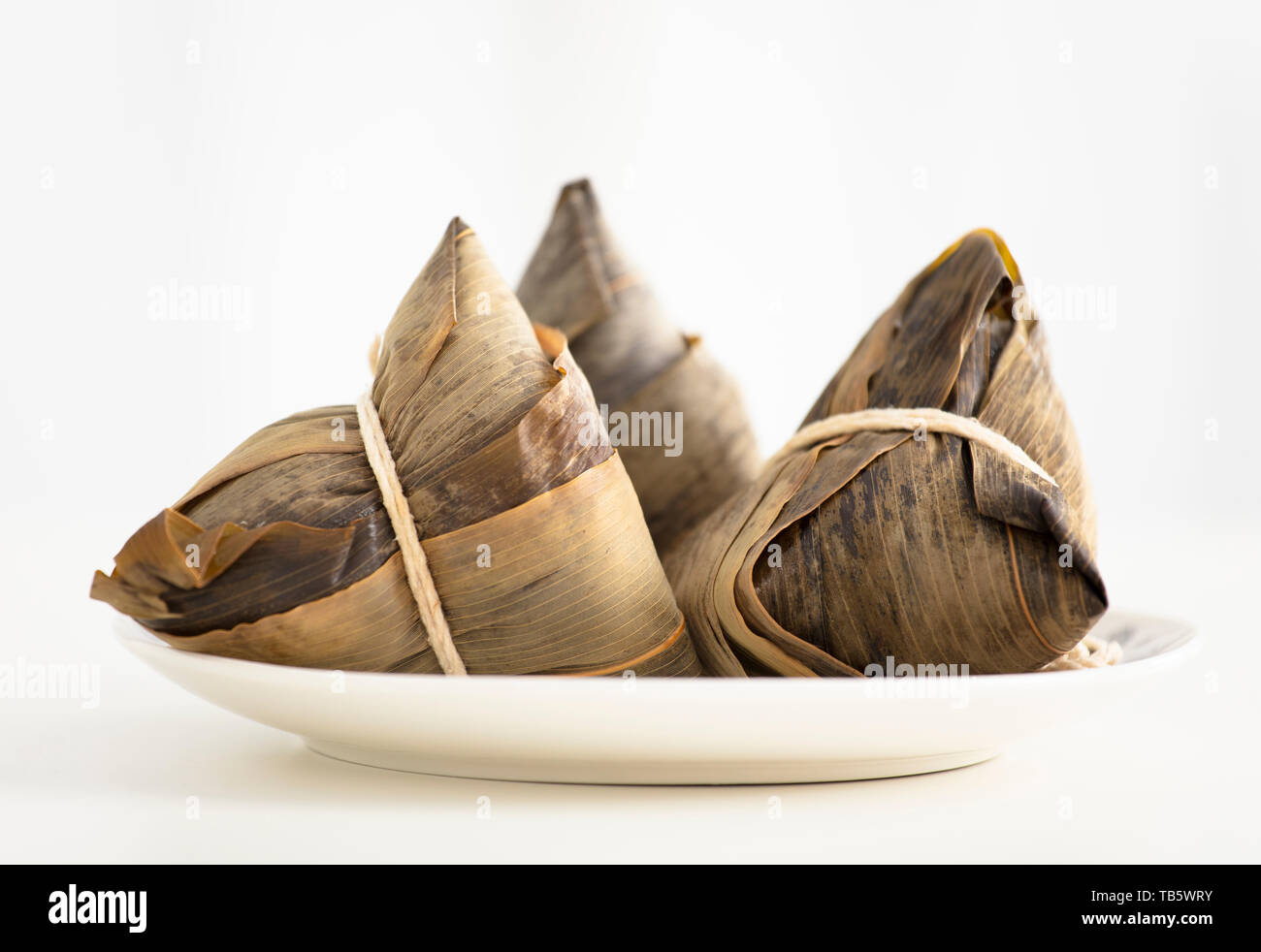 three traditional rice dumplings on table Stock Photo - Alamy