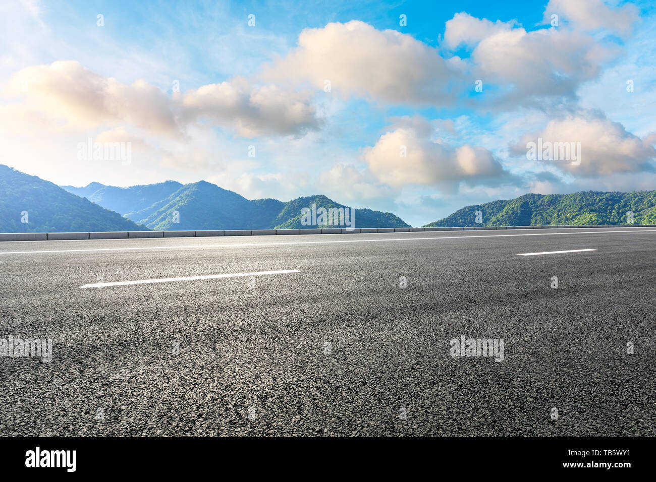 Empty highway road and beautiful mountain with clouds landscape Stock ...