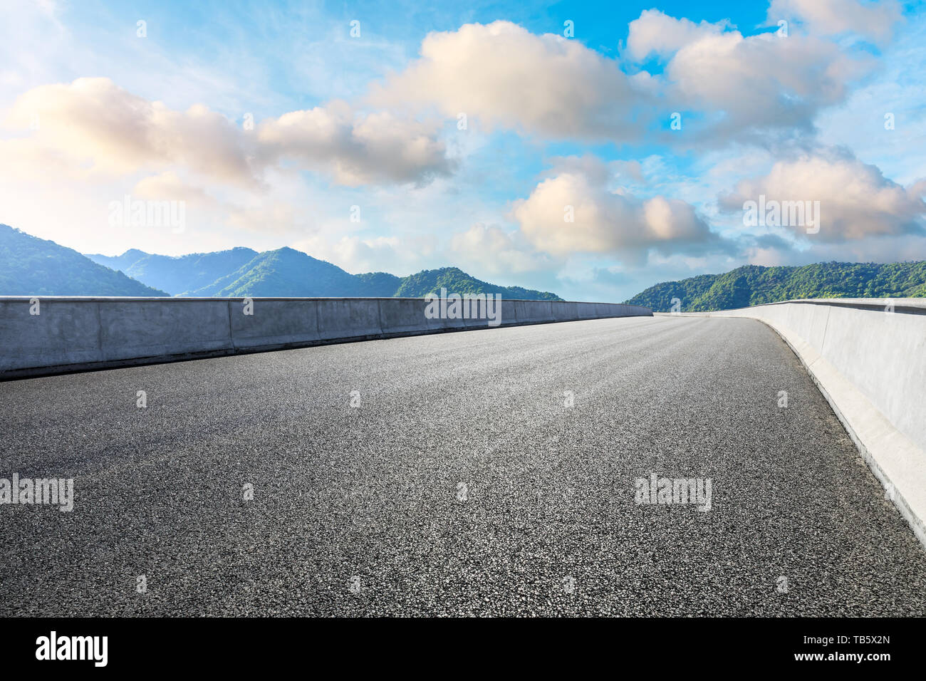 Empty highway road and beautiful mountain with clouds landscape Stock ...