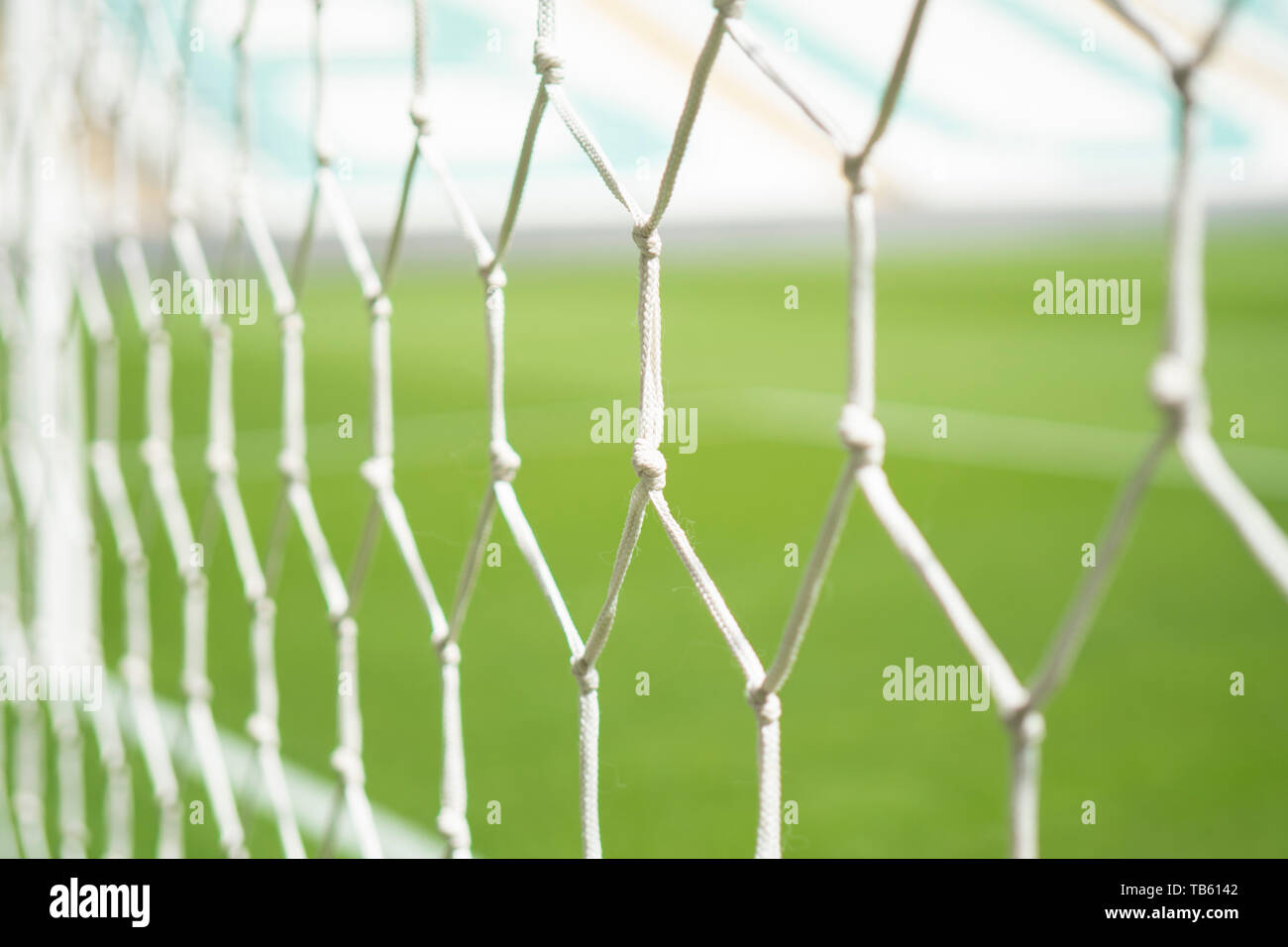 white football net, green grass background Stock Photo - Alamy