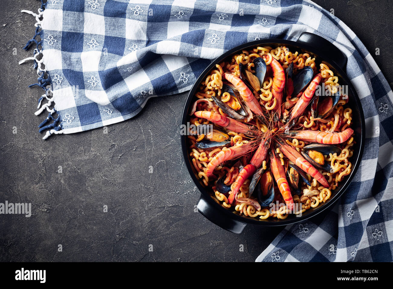 Fideua, a Paella like spanish dish with special pasta, king prawns ...