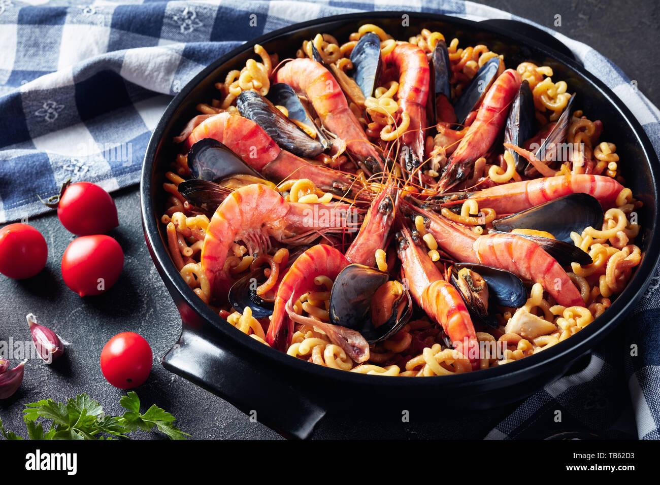 Fideua, a Paella like spanish dish with special pasta, king prawns ...