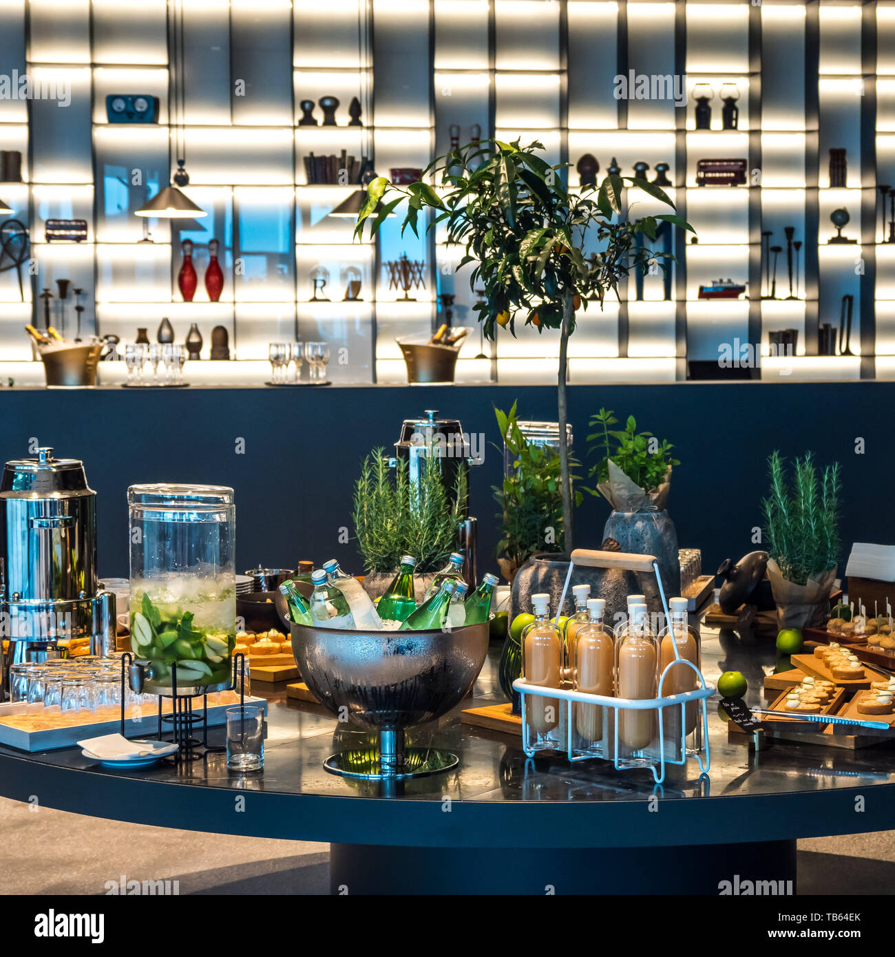 buffet table with an illuminated background Stock Photo - Alamy