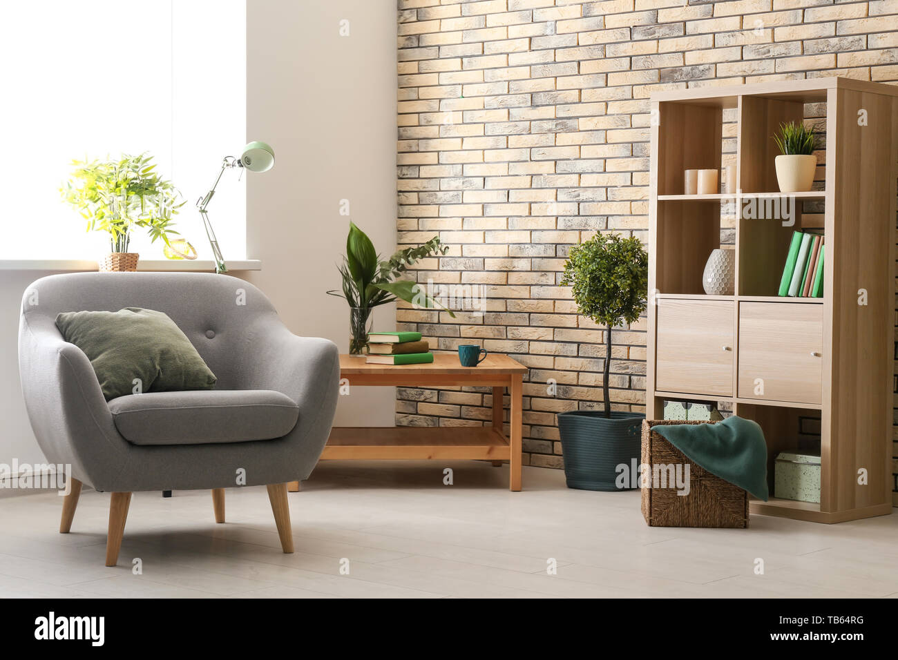 Interior of modern room with comfortable armchair Stock Photo - Alamy