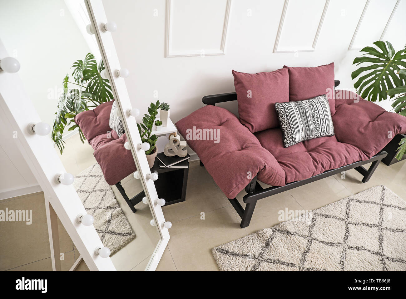 Interior of modern comfortable room with big mirror Stock Photo - Alamy