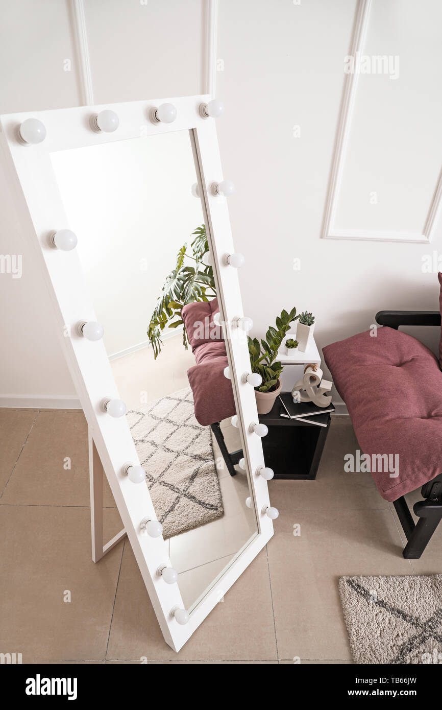 Interior of modern comfortable room with big mirror Stock Photo - Alamy