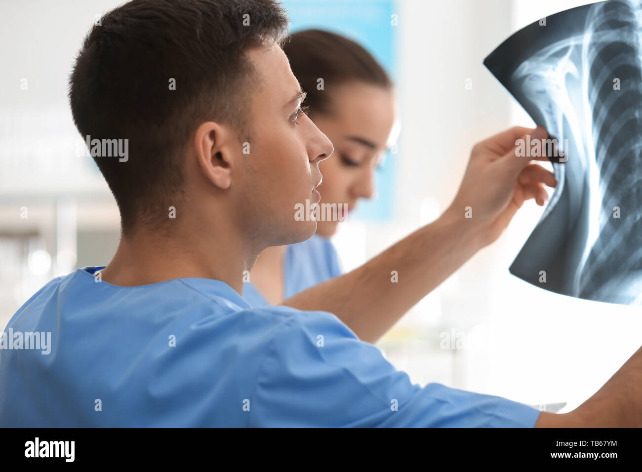 Young doctors studying X-ray image in clinic Stock Photo - Alamy