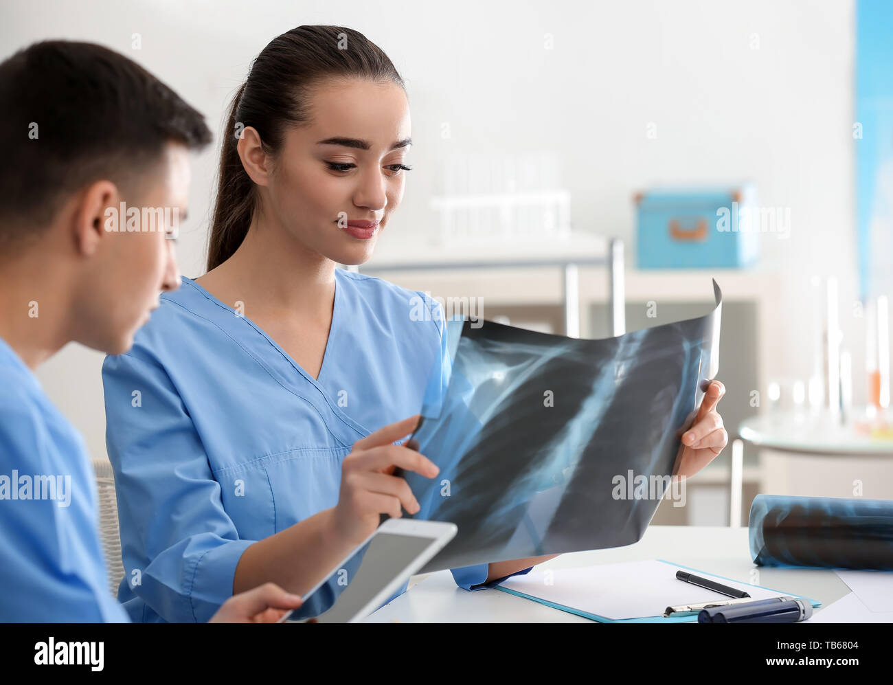 Young doctors studying X-ray image in clinic Stock Photo - Alamy