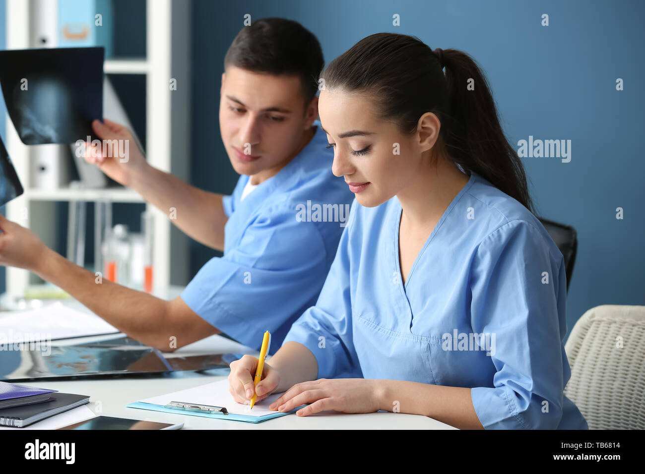 Young doctors studying X-ray image in clinic Stock Photo - Alamy