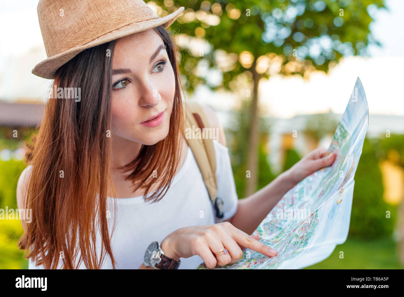 travel guide, tourism in Europe, woman tourist with map on the street ...