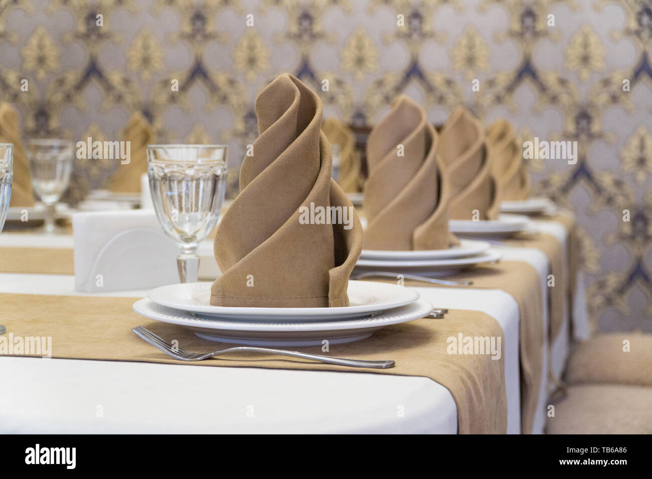 serving banquet table in a luxurious restaurant in beige and white ...