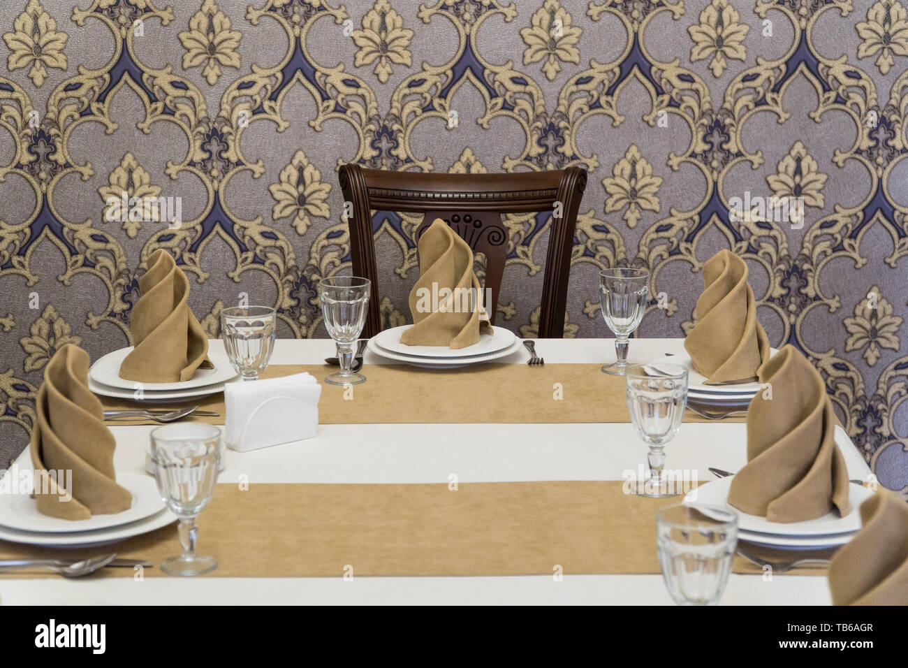 serving banquet table in a luxurious restaurant in beige and white ...