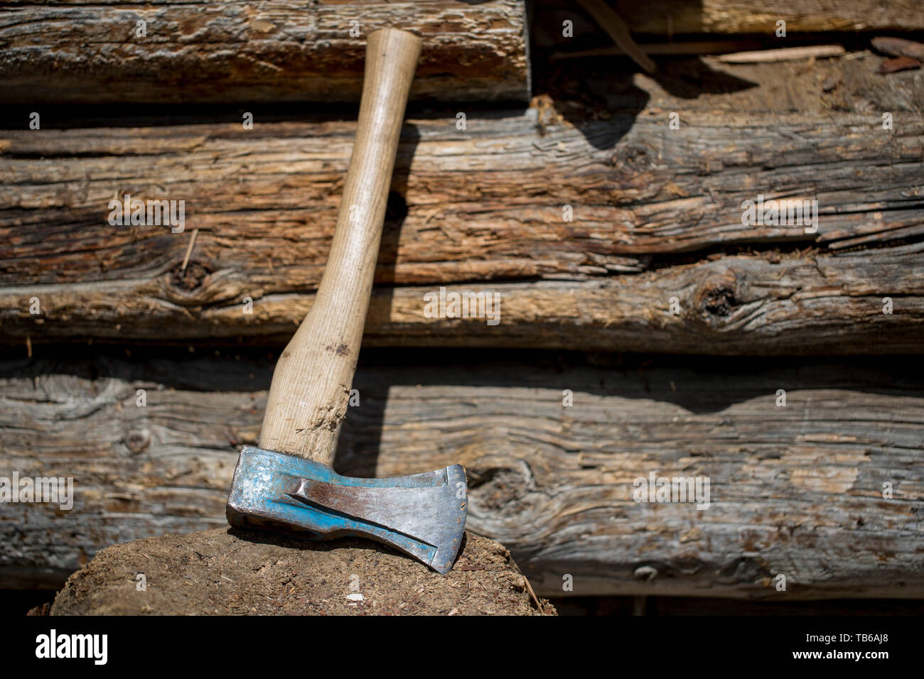 Hatchet at old wooden Alpine Cabin Stock Photo - Alamy