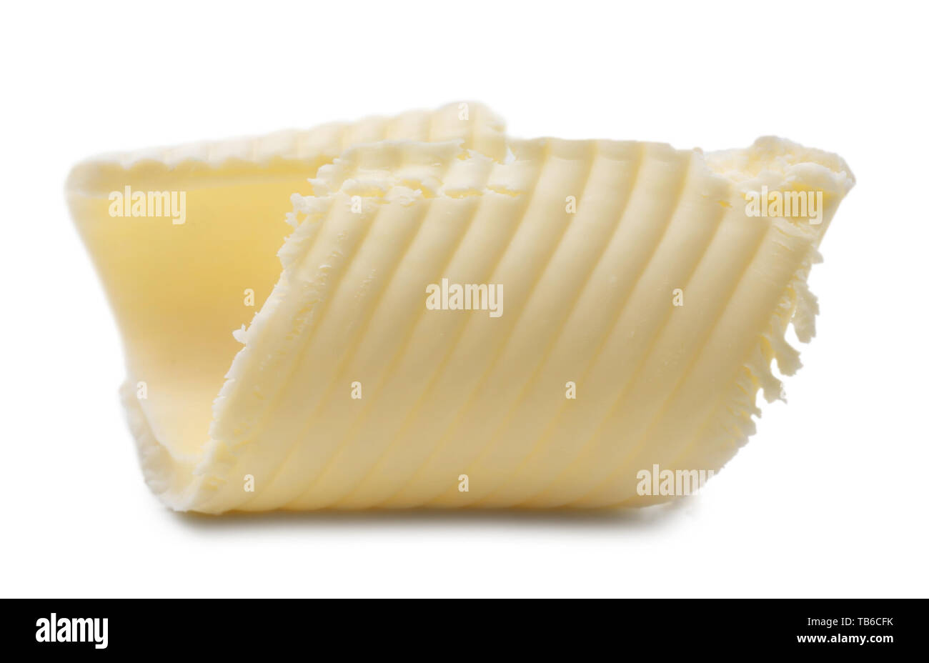 Butter curl on white background Stock Photo - Alamy