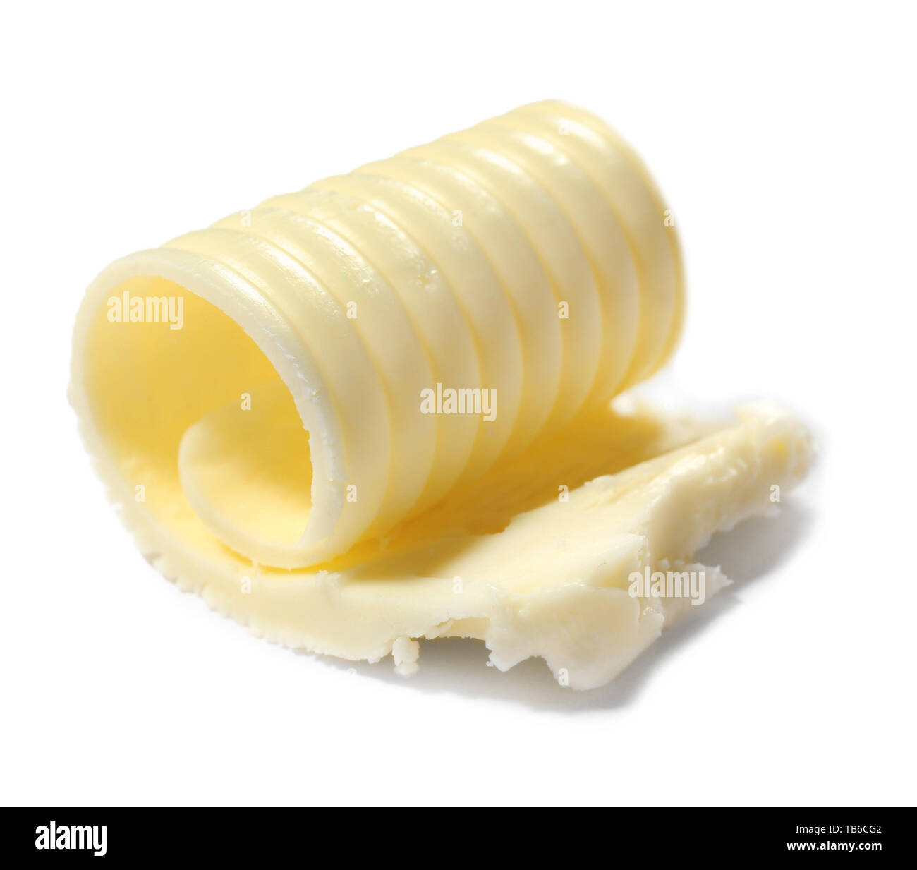Butter curl on white background Stock Photo - Alamy
