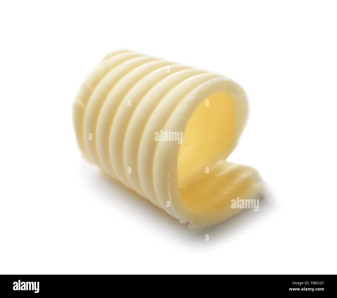 Butter curl on white background Stock Photo - Alamy