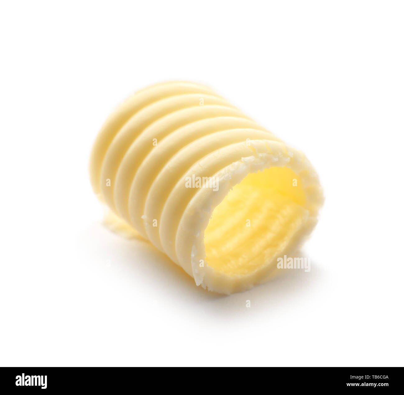 Butter curl on white background Stock Photo - Alamy
