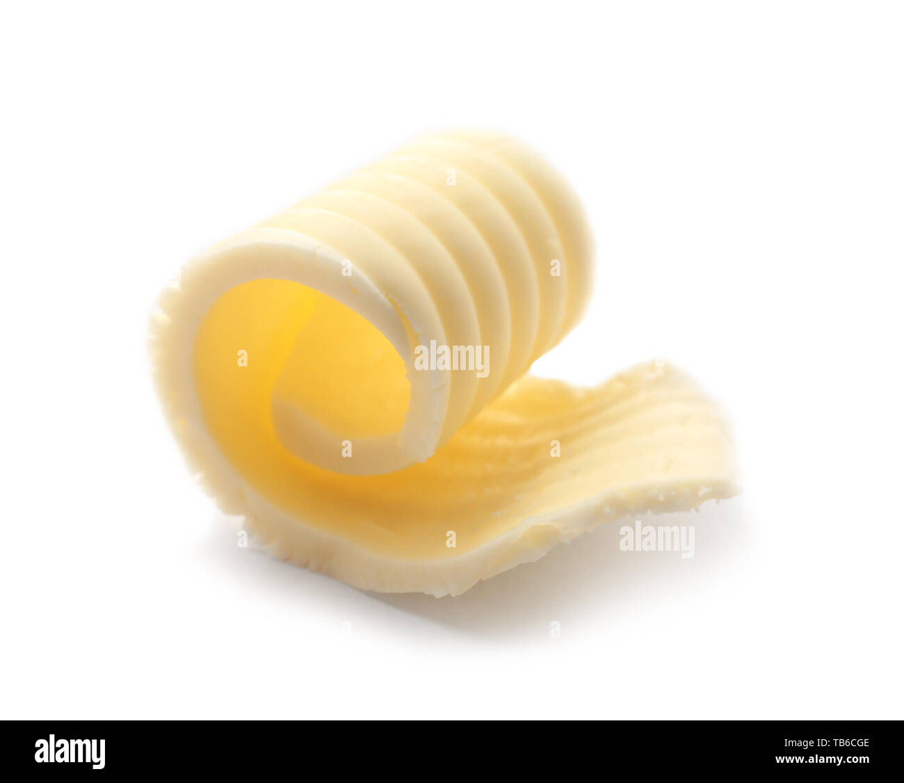 Butter curl on white background Stock Photo - Alamy
