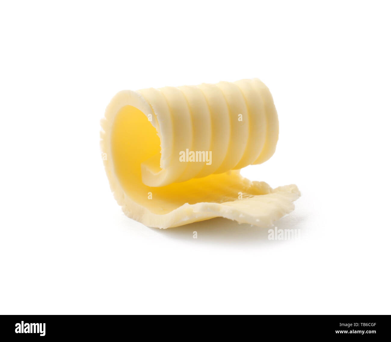 Butter curl on white background Stock Photo - Alamy