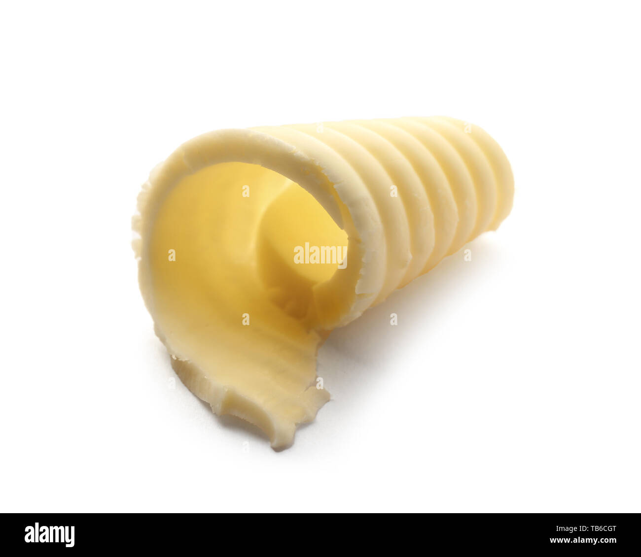 Butter curl on white background Stock Photo - Alamy