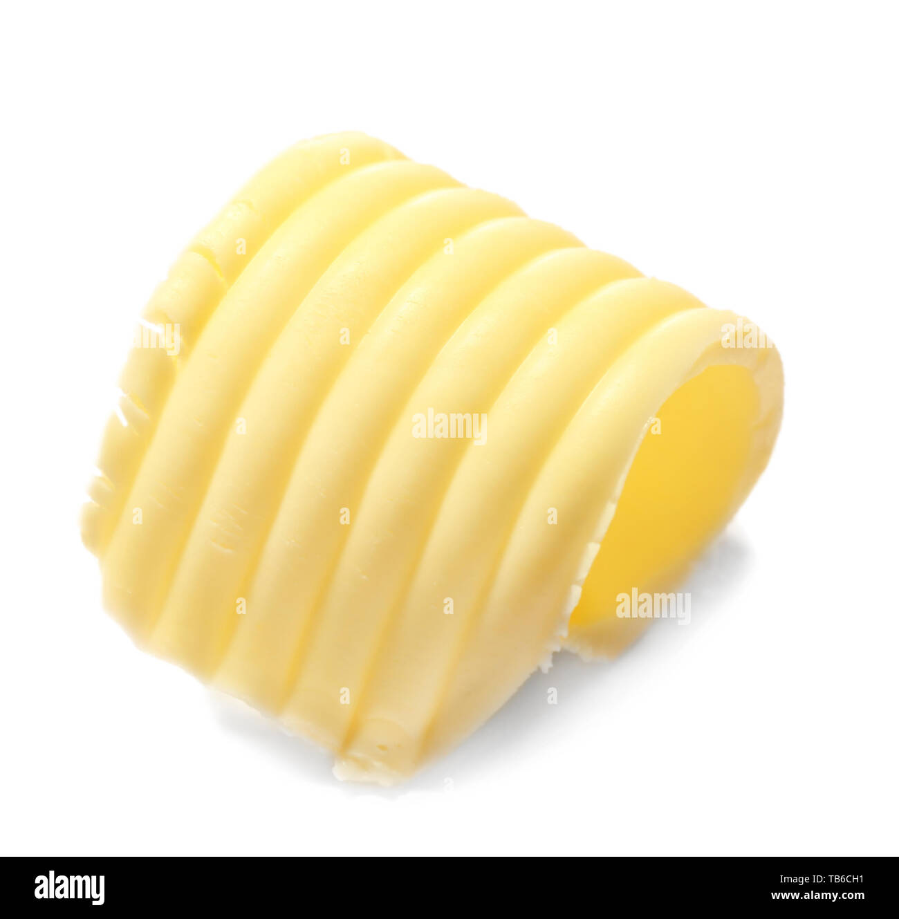 Butter curl on white background Stock Photo - Alamy