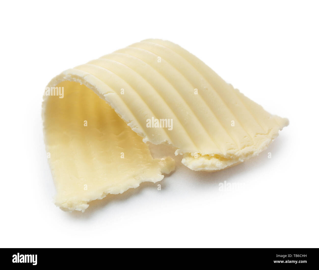 Butter curl on white background Stock Photo - Alamy