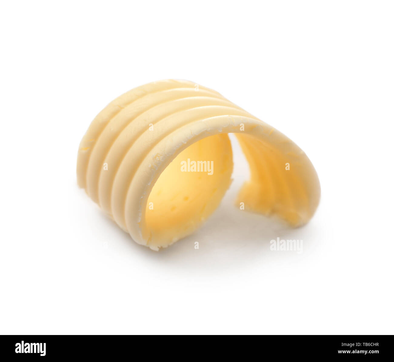Butter curl on white background Stock Photo - Alamy
