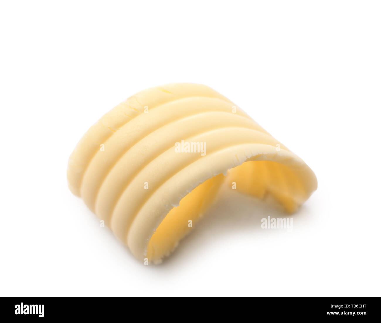 Butter curl on white background Stock Photo - Alamy