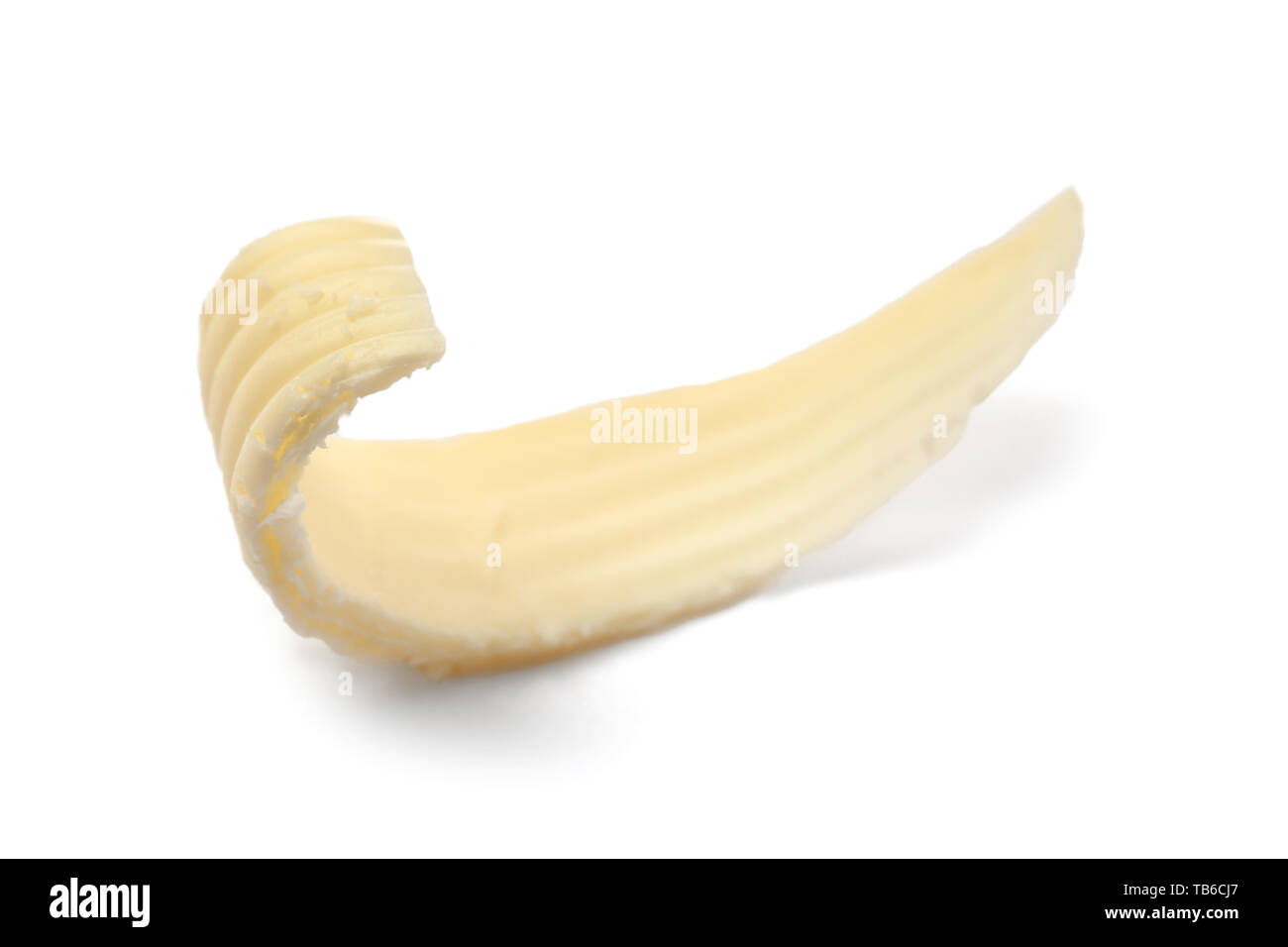 Butter curl on white background Stock Photo - Alamy