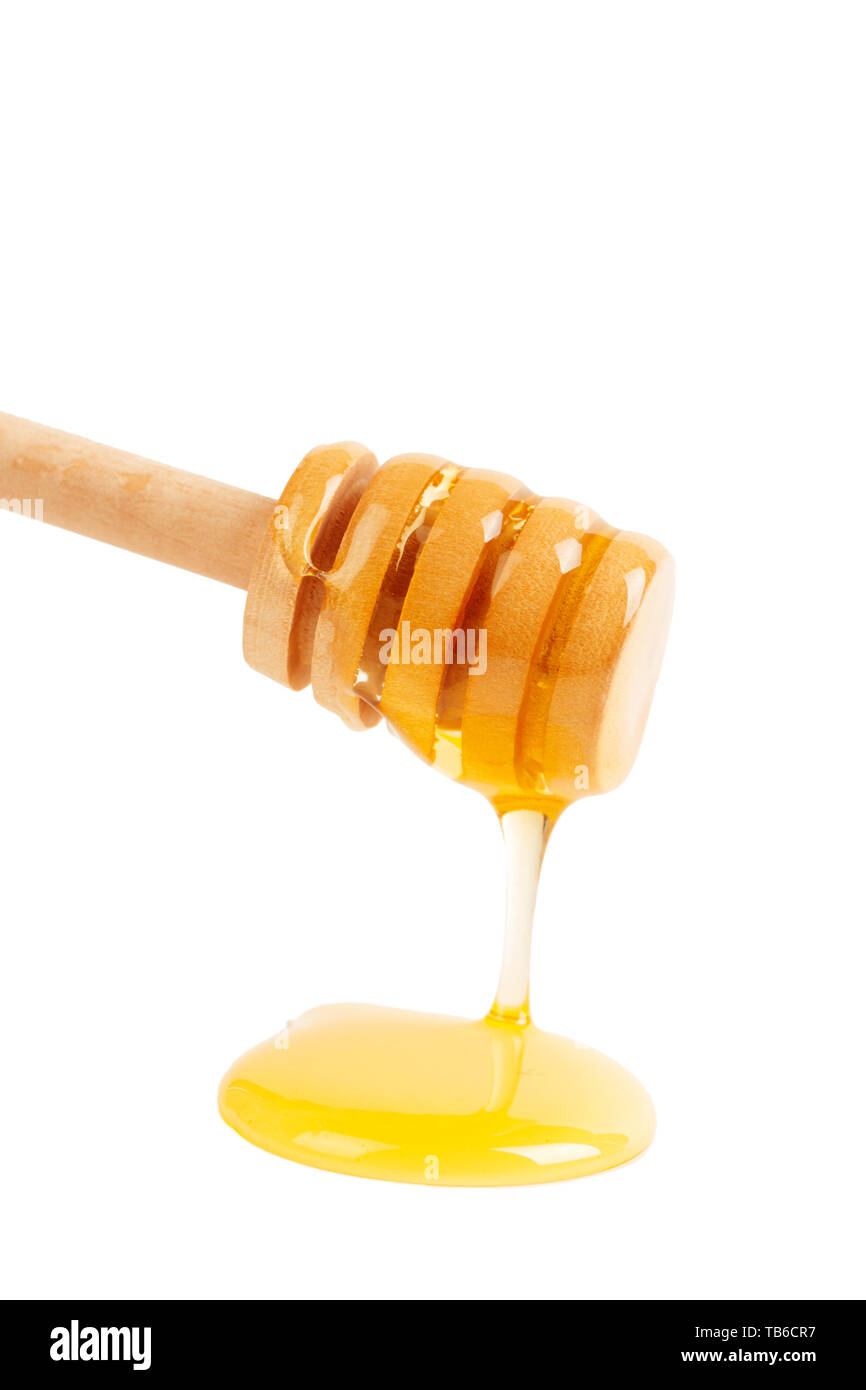 honey with wooden drizzler isolated on white background Stock Photo - Alamy