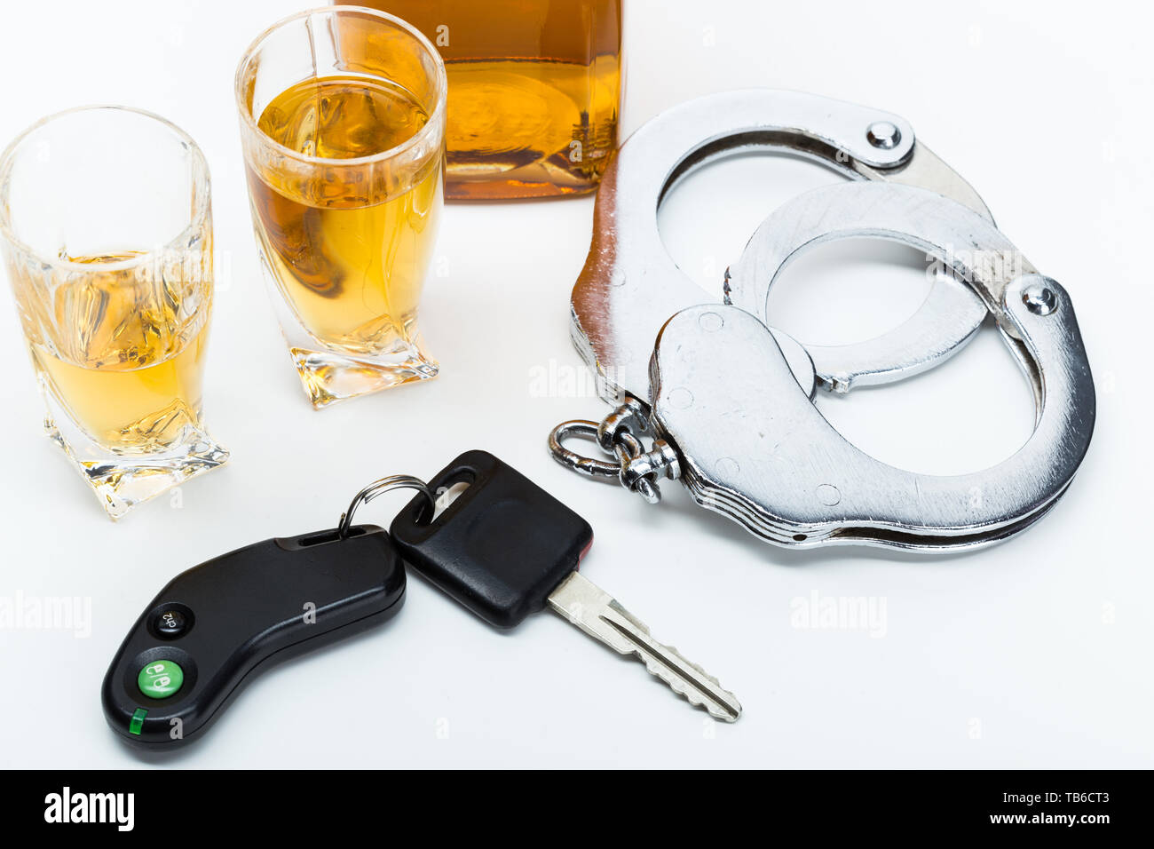 Car key on the bar with spilled alcohol Stock Photo - Alamy