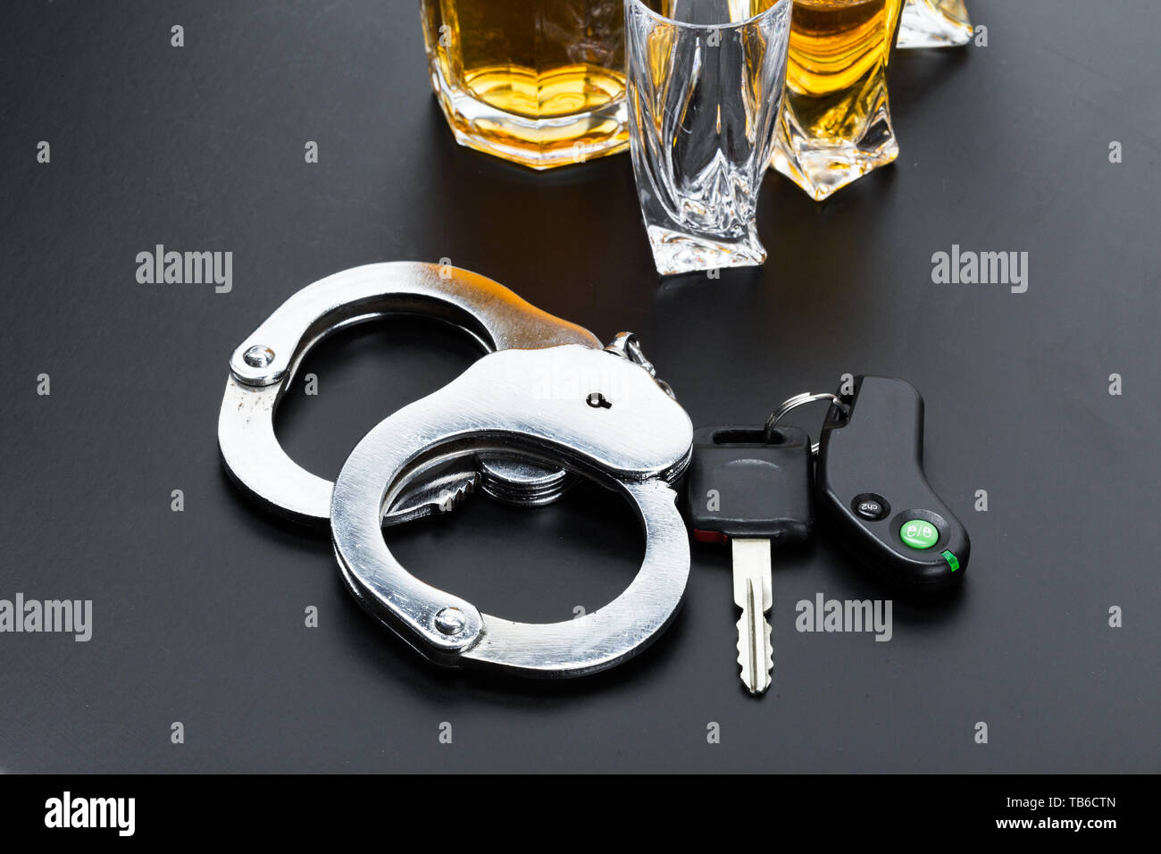 Car key on the bar with spilled alcohol Stock Photo - Alamy