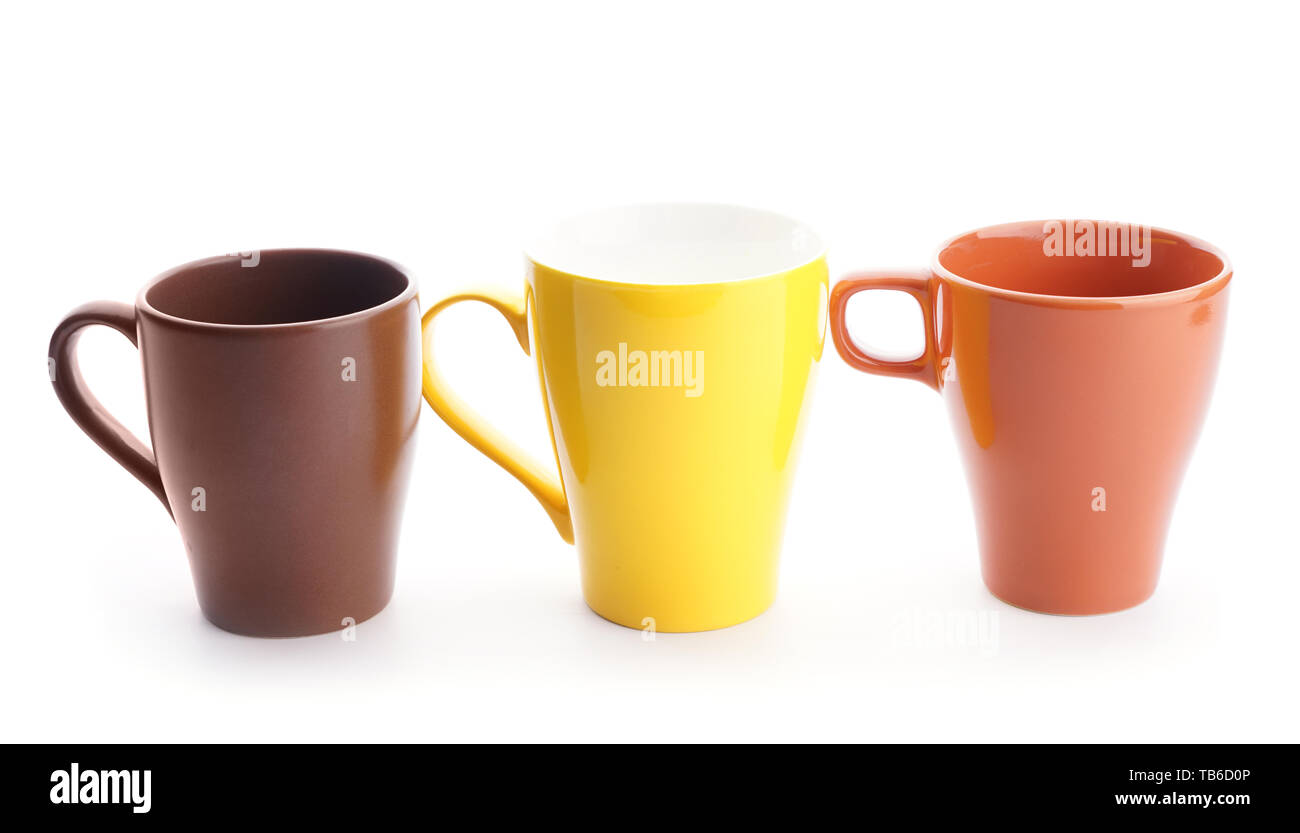 Colorful empty cups on white background Stock Photo - Alamy