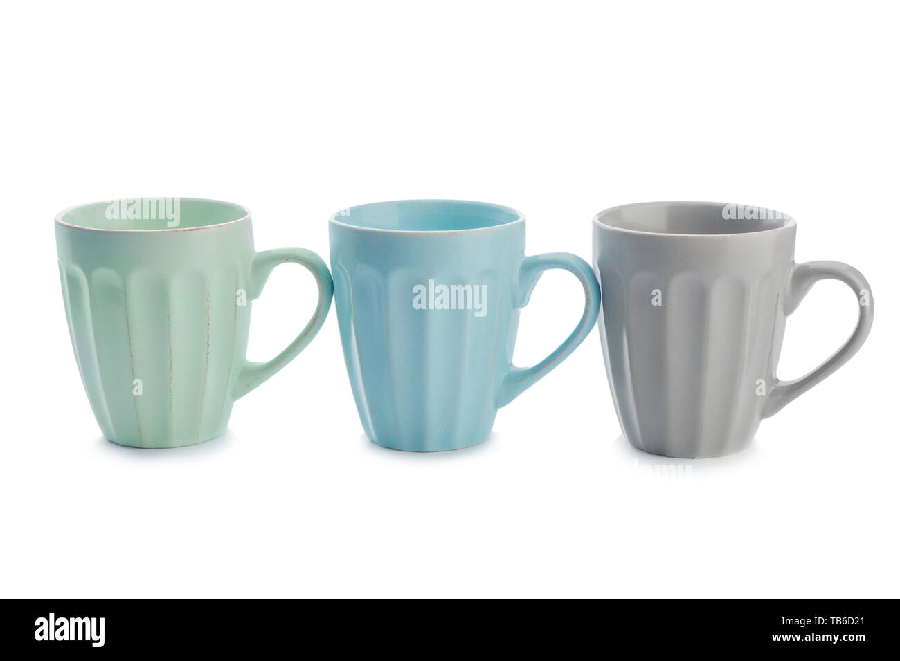 Colorful empty cups on white background Stock Photo - Alamy