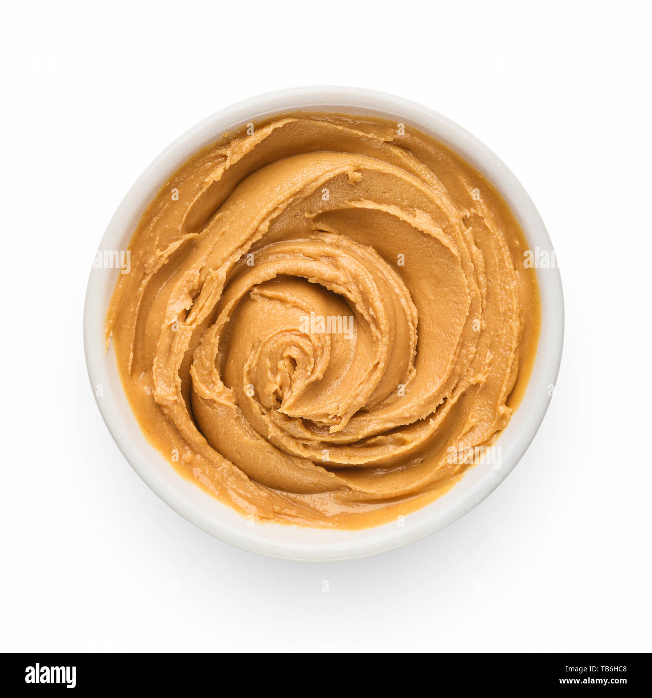 ?eanut butter in glass bowl isolated on white background, top view ...