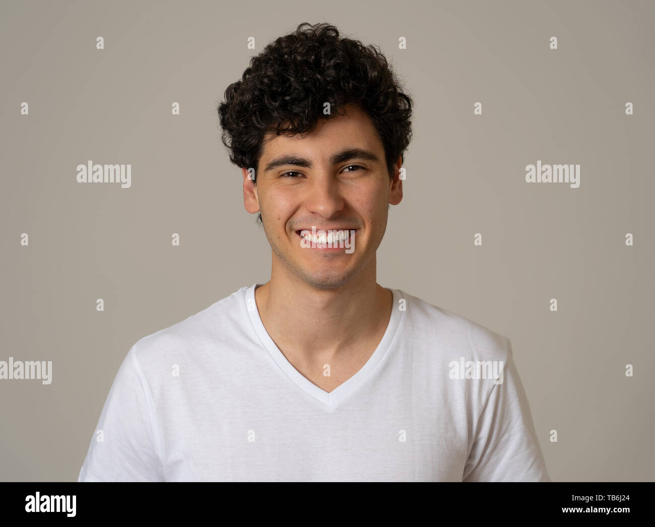 Close up portrait of happy young man having fun and joy smiling and ...