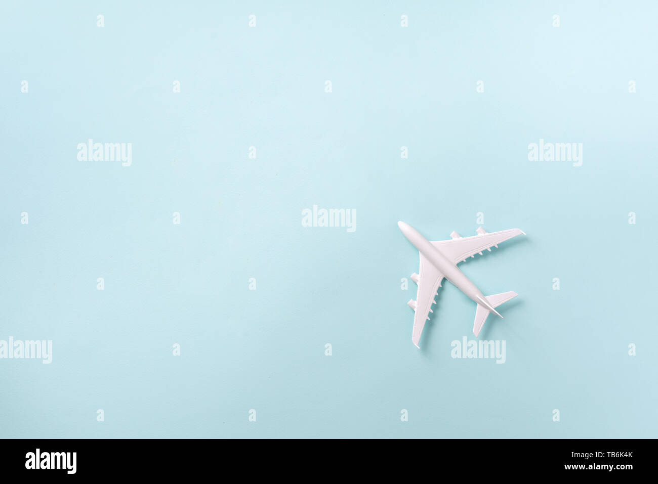 White plane, airplane on blue pastel color background with copy space ...