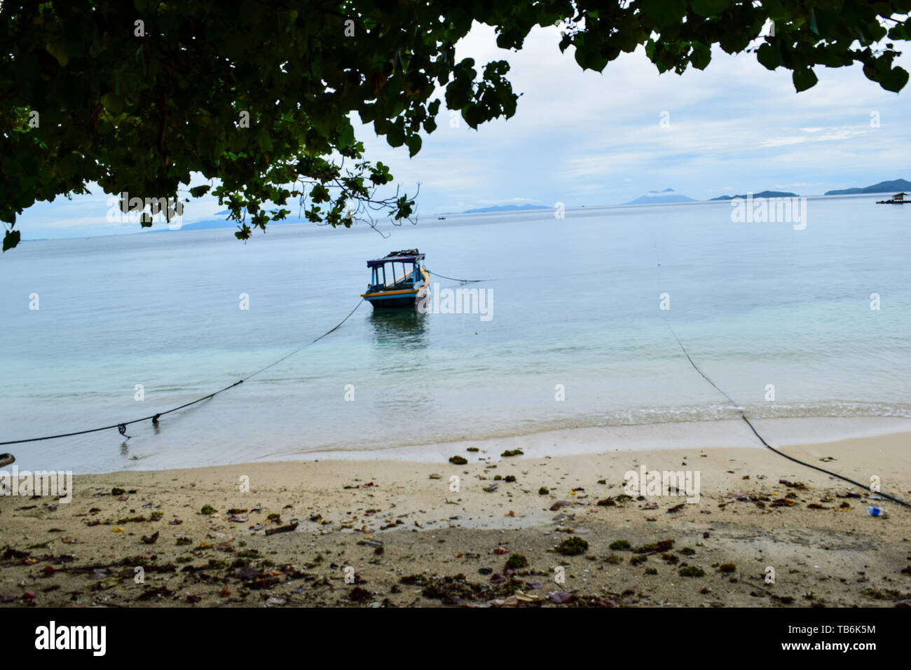 traditional fishing wooden boat near island in indonesia island Stock ...