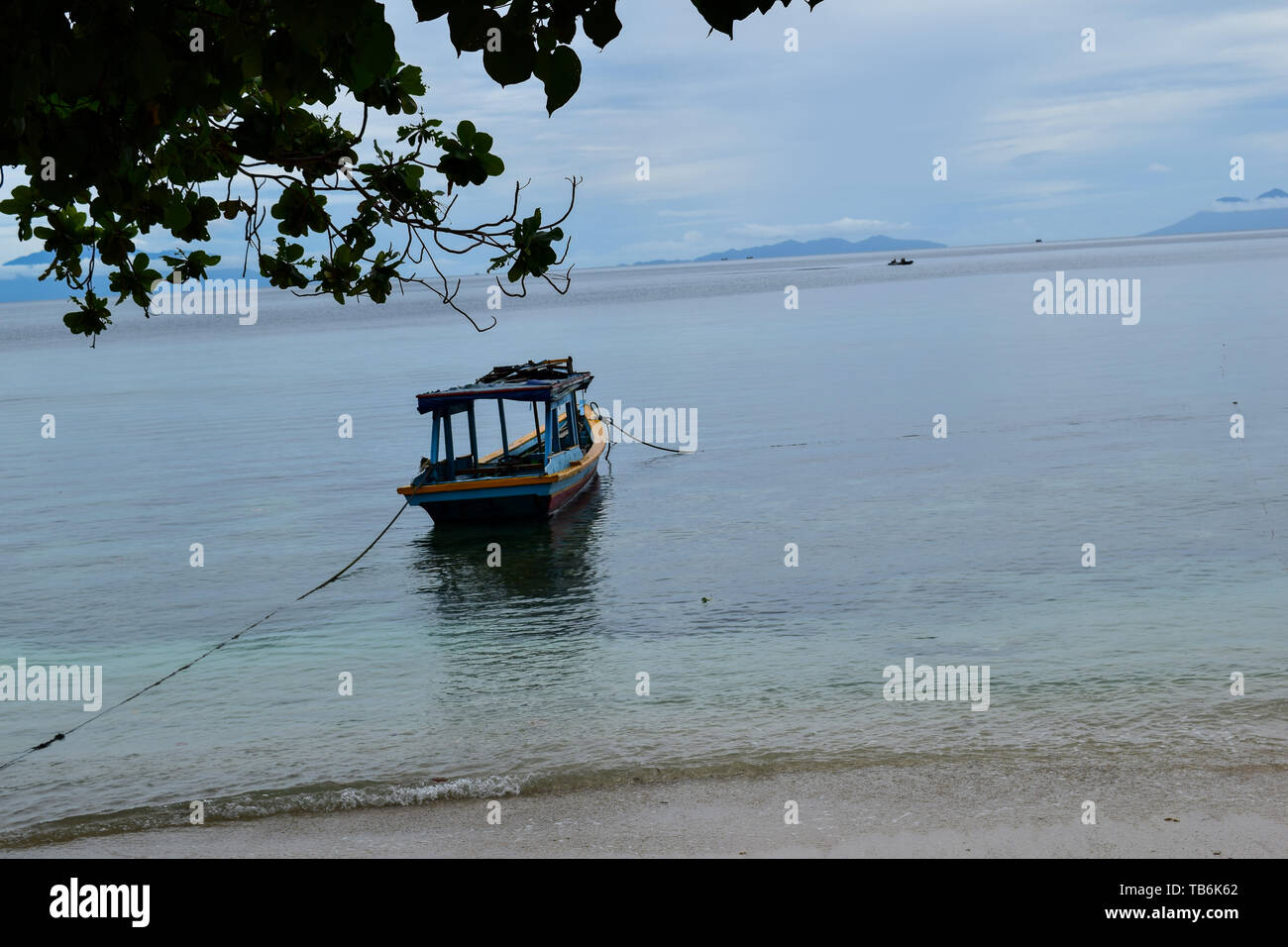 traditional fishing wooden boat near island in indonesia island Stock ...