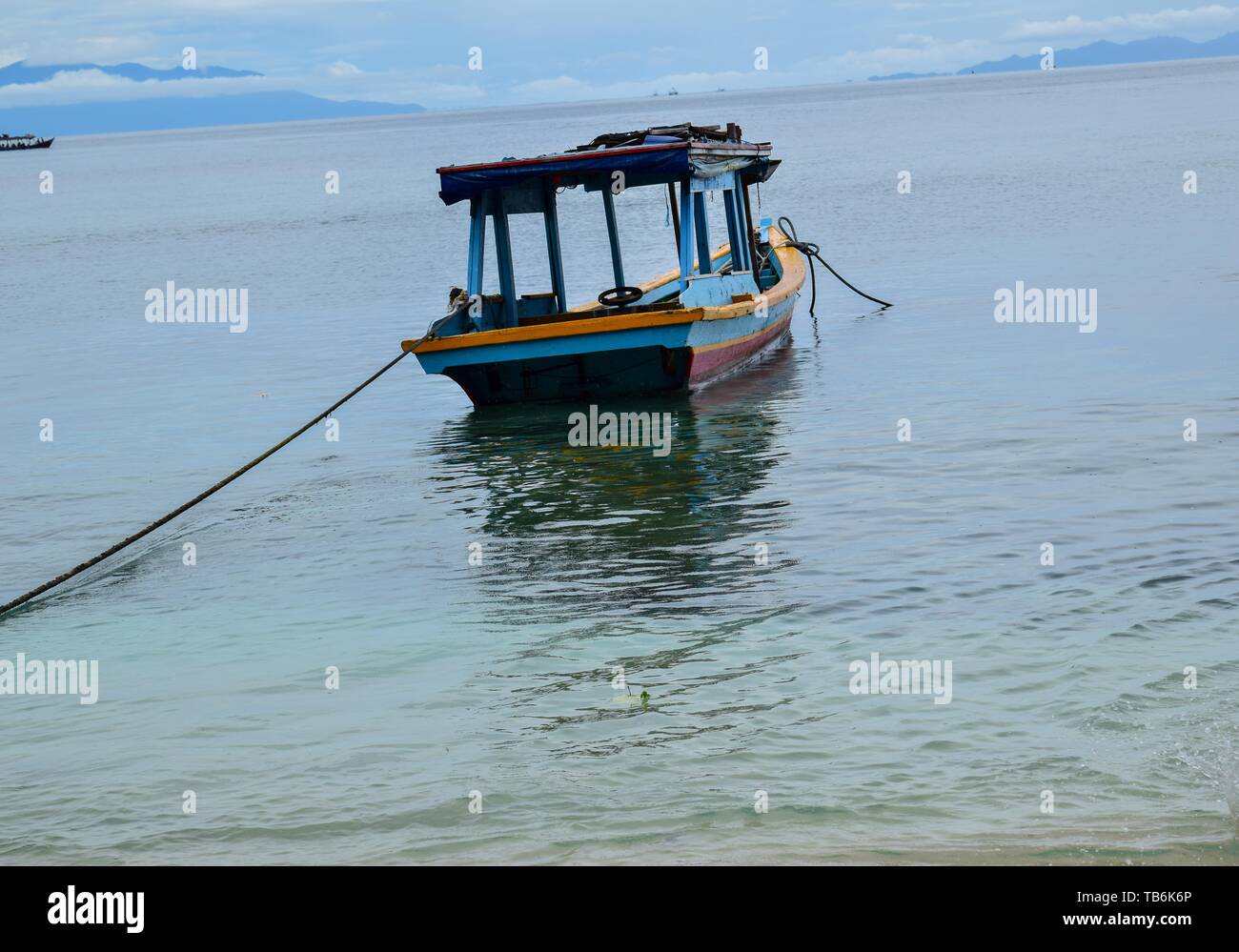 traditional fishing wooden boat near island in indonesia island Stock ...