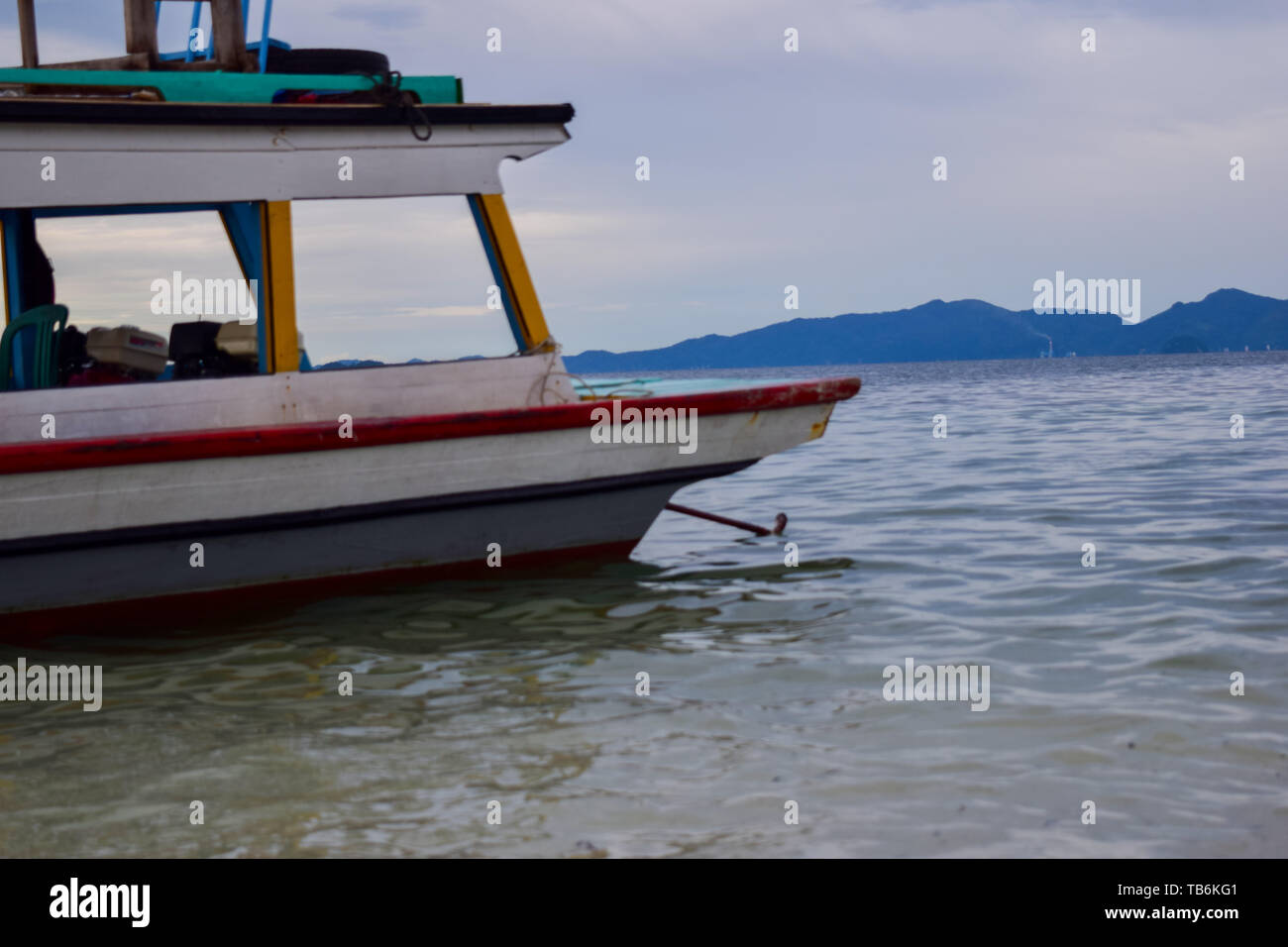 traditional fishing wooden boat near island in indonesia island Stock ...