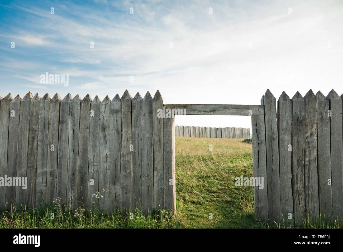 Vintage gateway and defense fence, ancient historic area surrounded ...