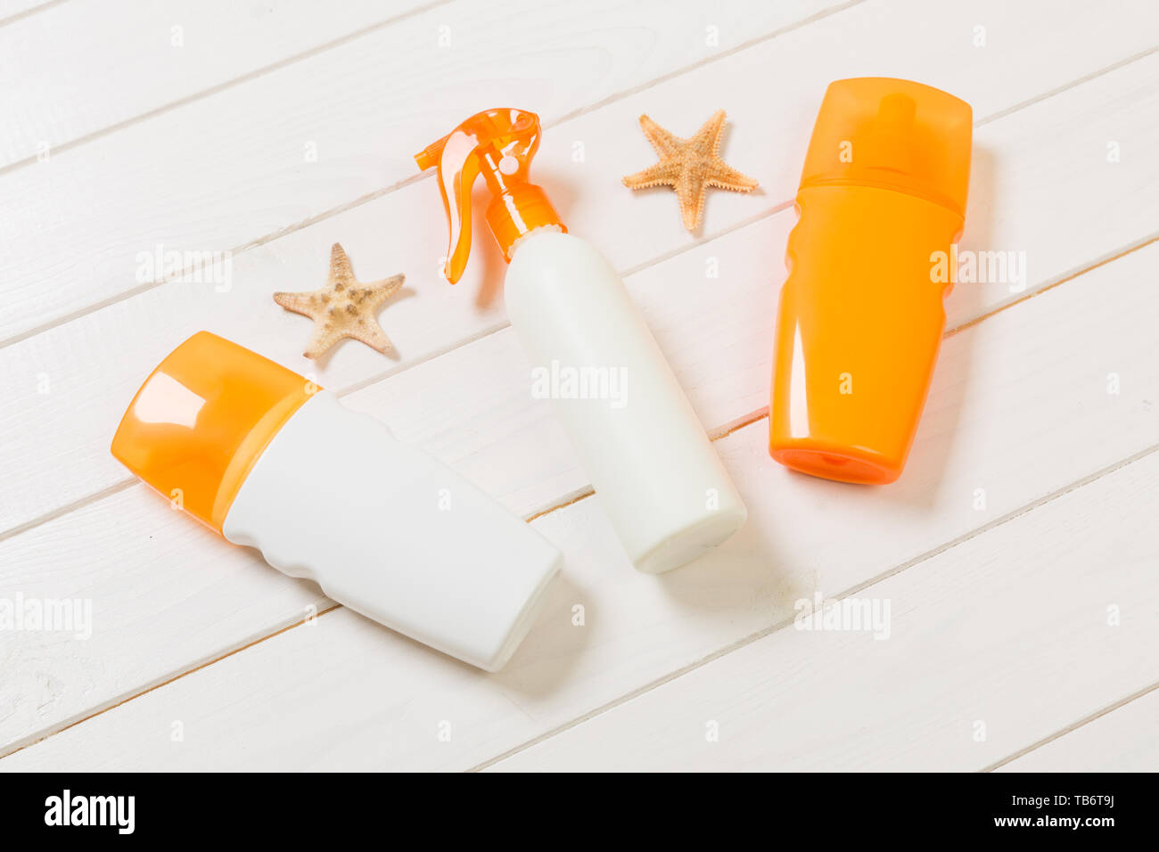 flat lay concept summer travel vacation. Sunscreen bottles with ...