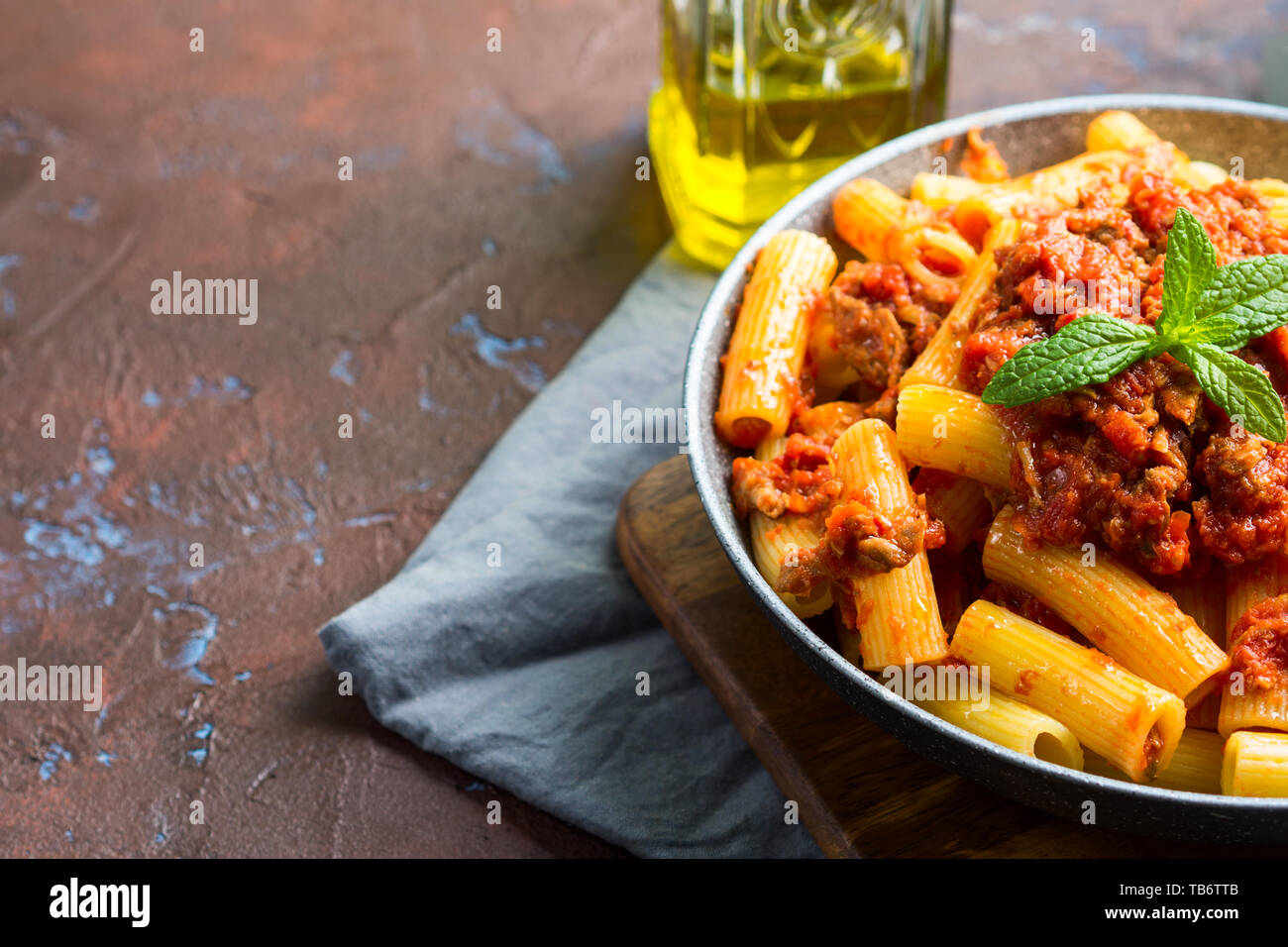 Delicious rigatoni pasta with italian tomato meat ragu sauce served in ...