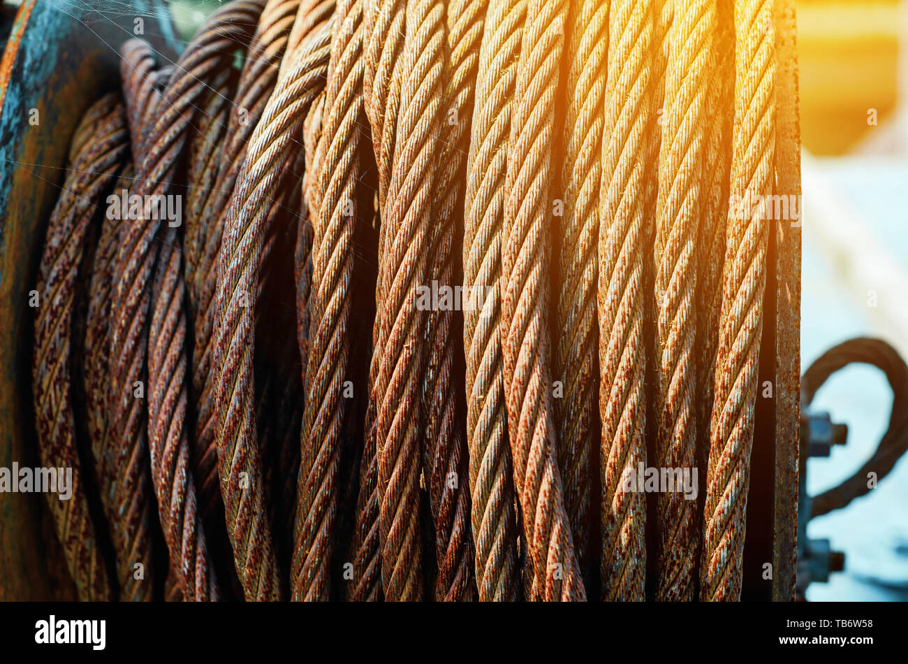 Rusty metal rope wound on a reel. Vintage metal background Stock Photo ...