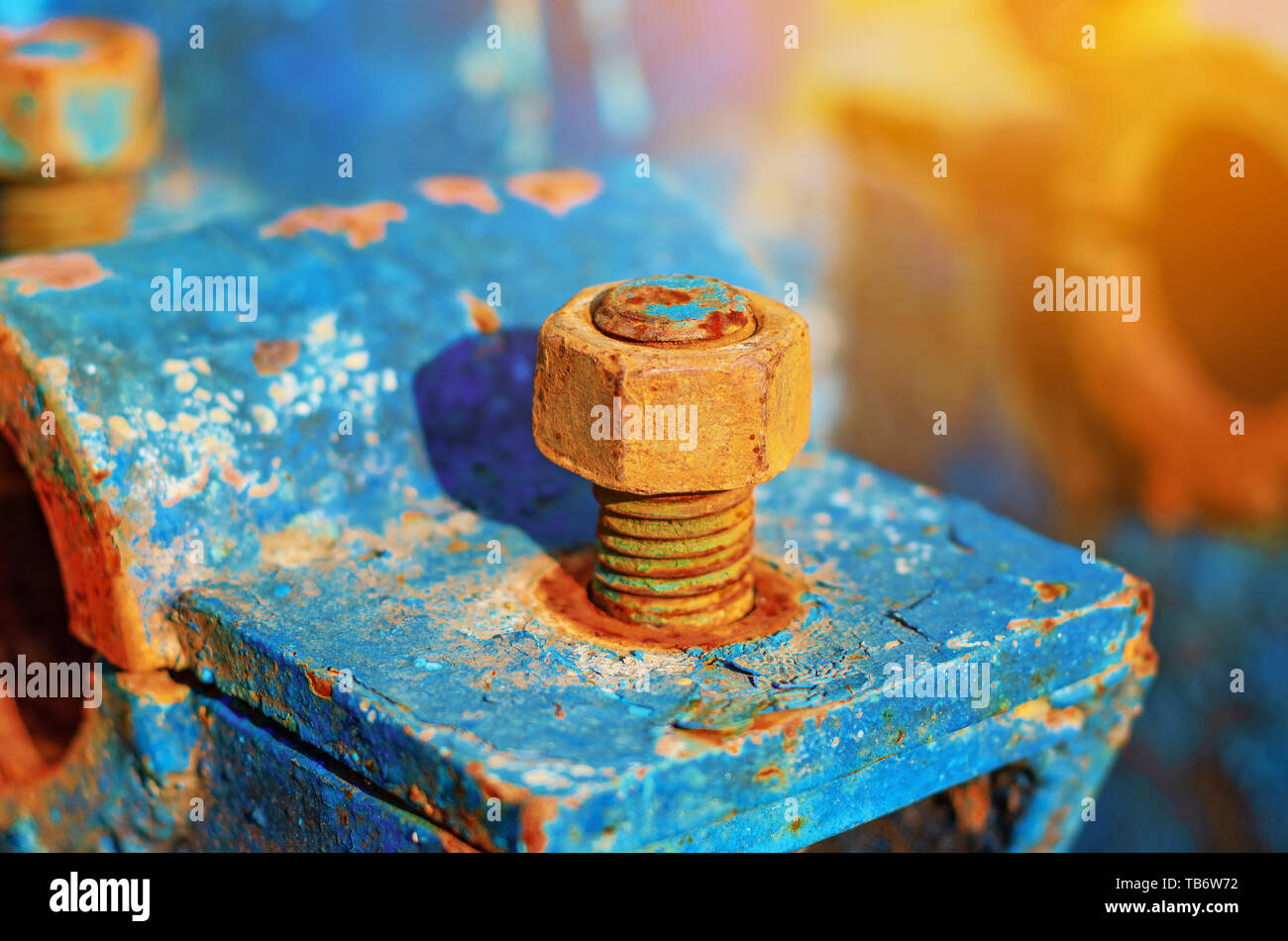 Rusty metal bolts and nuts on metal mounts. Abandoned equipment Stock ...
