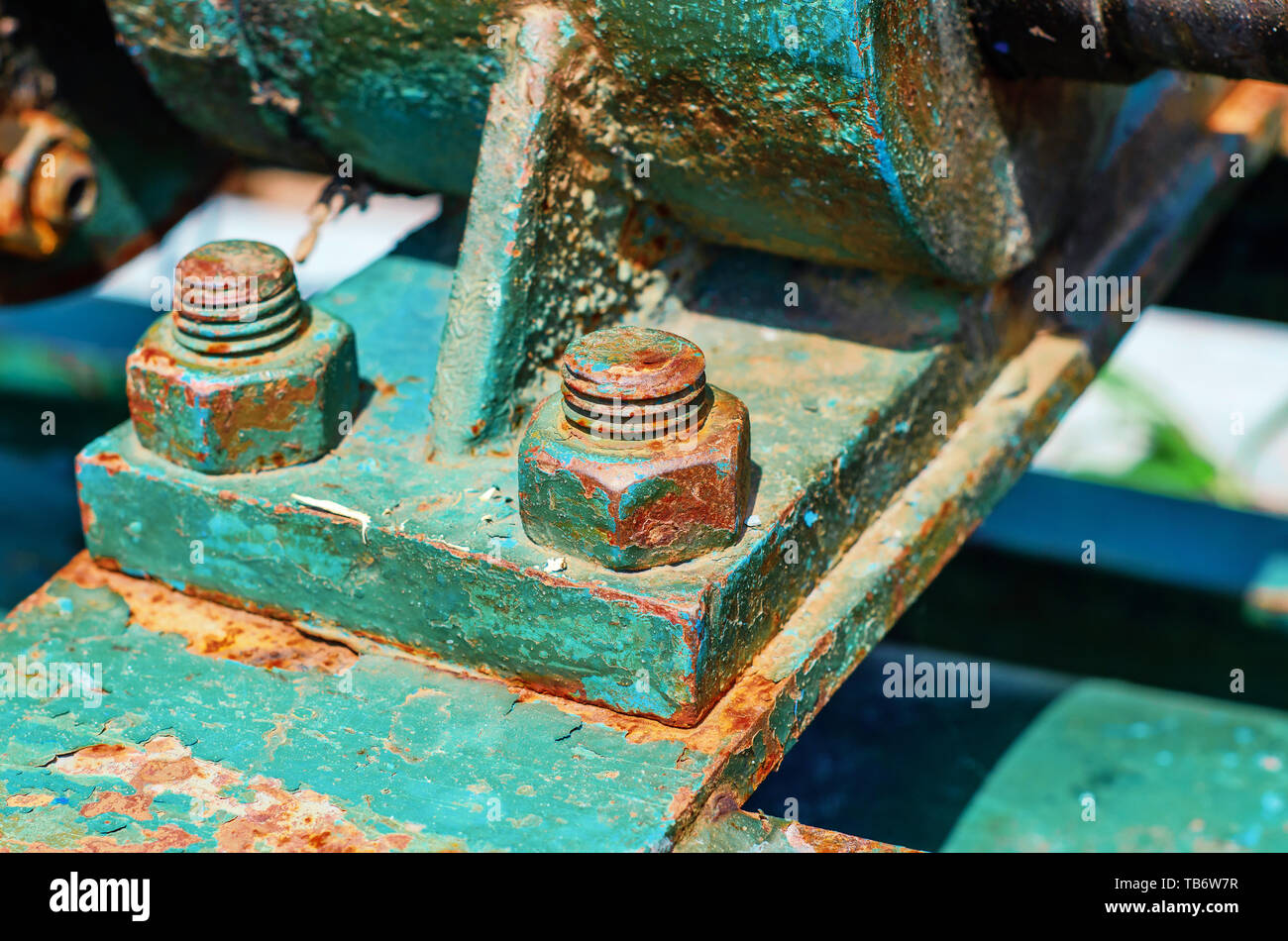 Rusty metal bolts and nuts on metal mounts. Abandoned equipment Stock ...